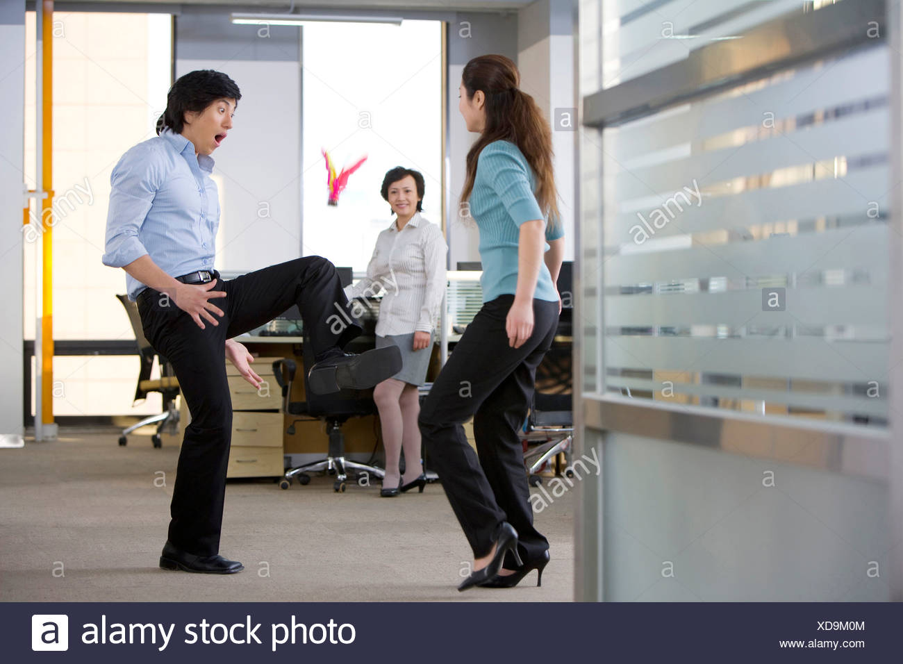 Men And Women Kicking Shuttlecock High Resolution Stock Photography and ...