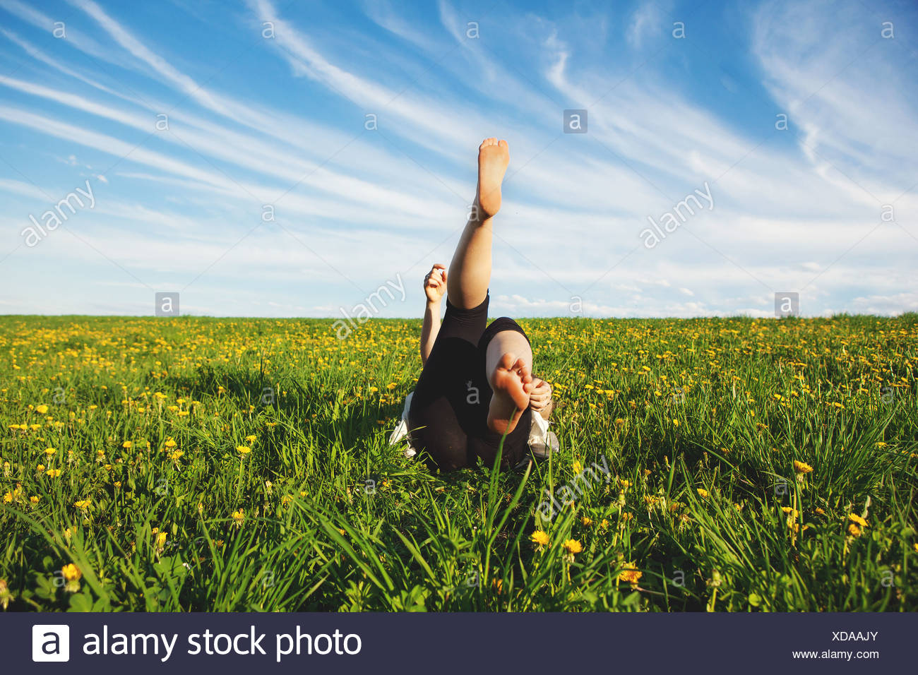 Woman Lying On Back Legs Up High Resolution Stock Photography and ...