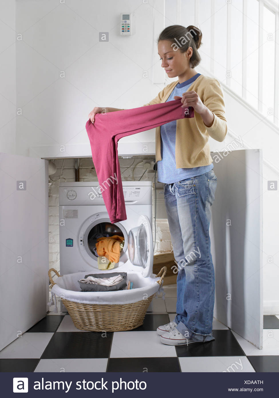 Woman Removing Clothes High Resolution Stock Photography and Images - Alamy