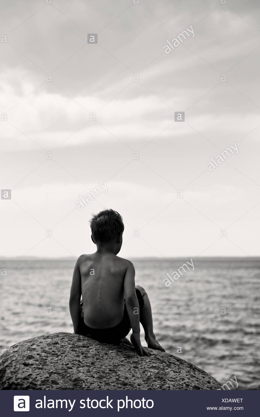 Sitting On Rock Stock Photos & Sitting On Rock Stock Images - Alamy