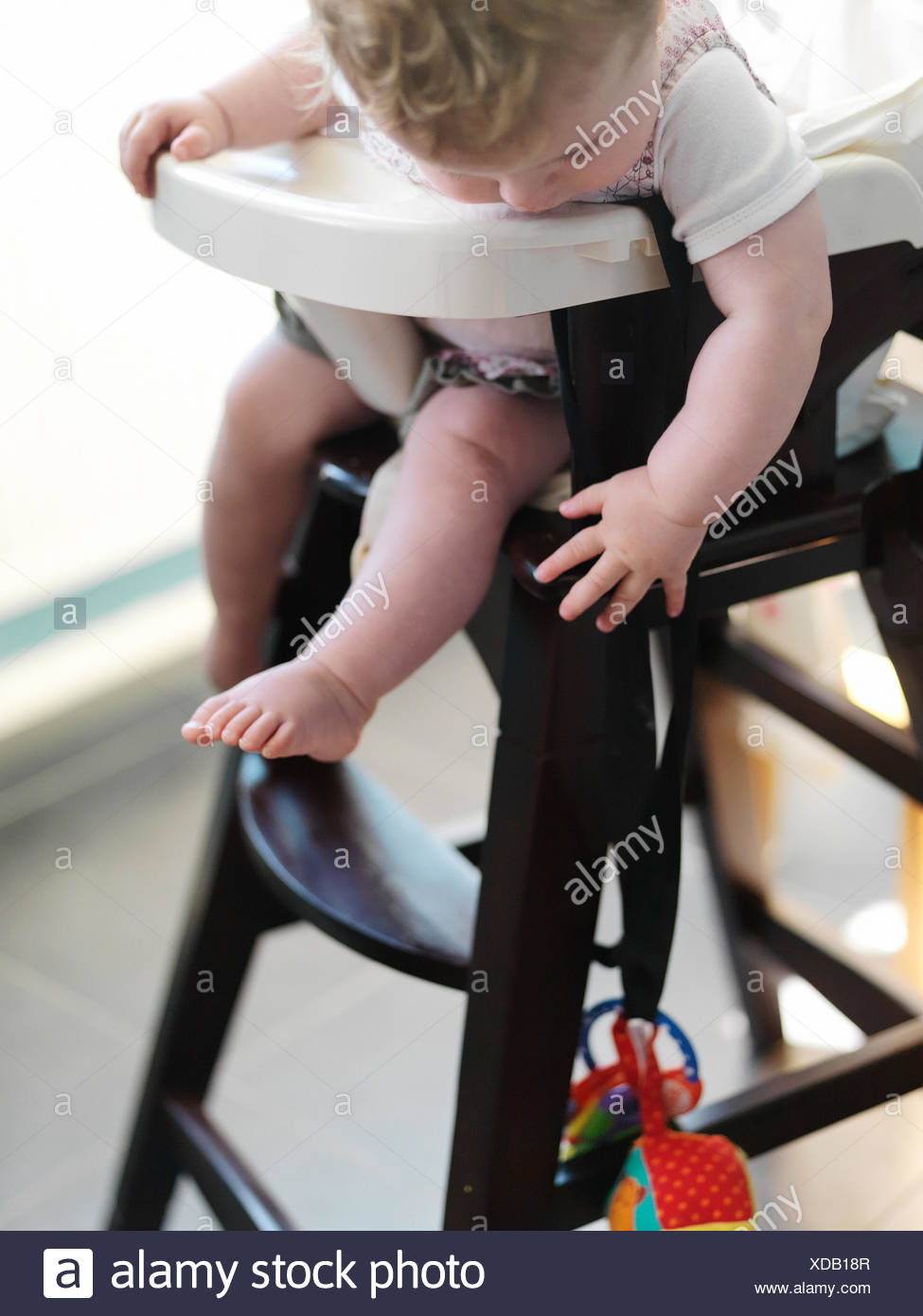 Child Sitting Down Chair Stock Photos & Child Sitting Down Chair Stock ...