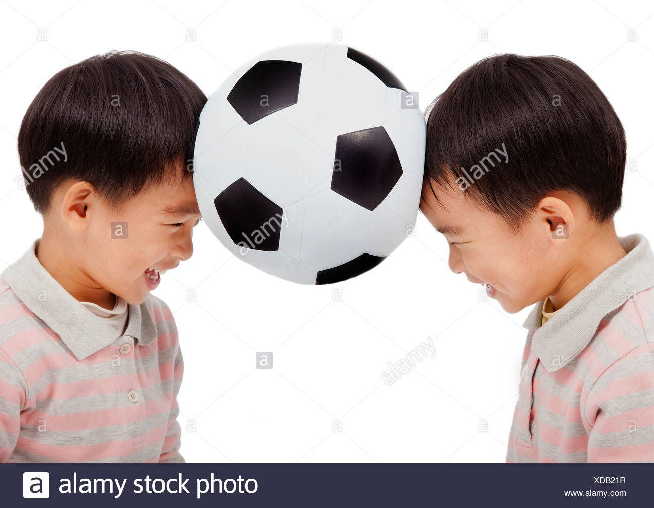 Young Boys Playing Football Head High Resolution Stock Photography and ...