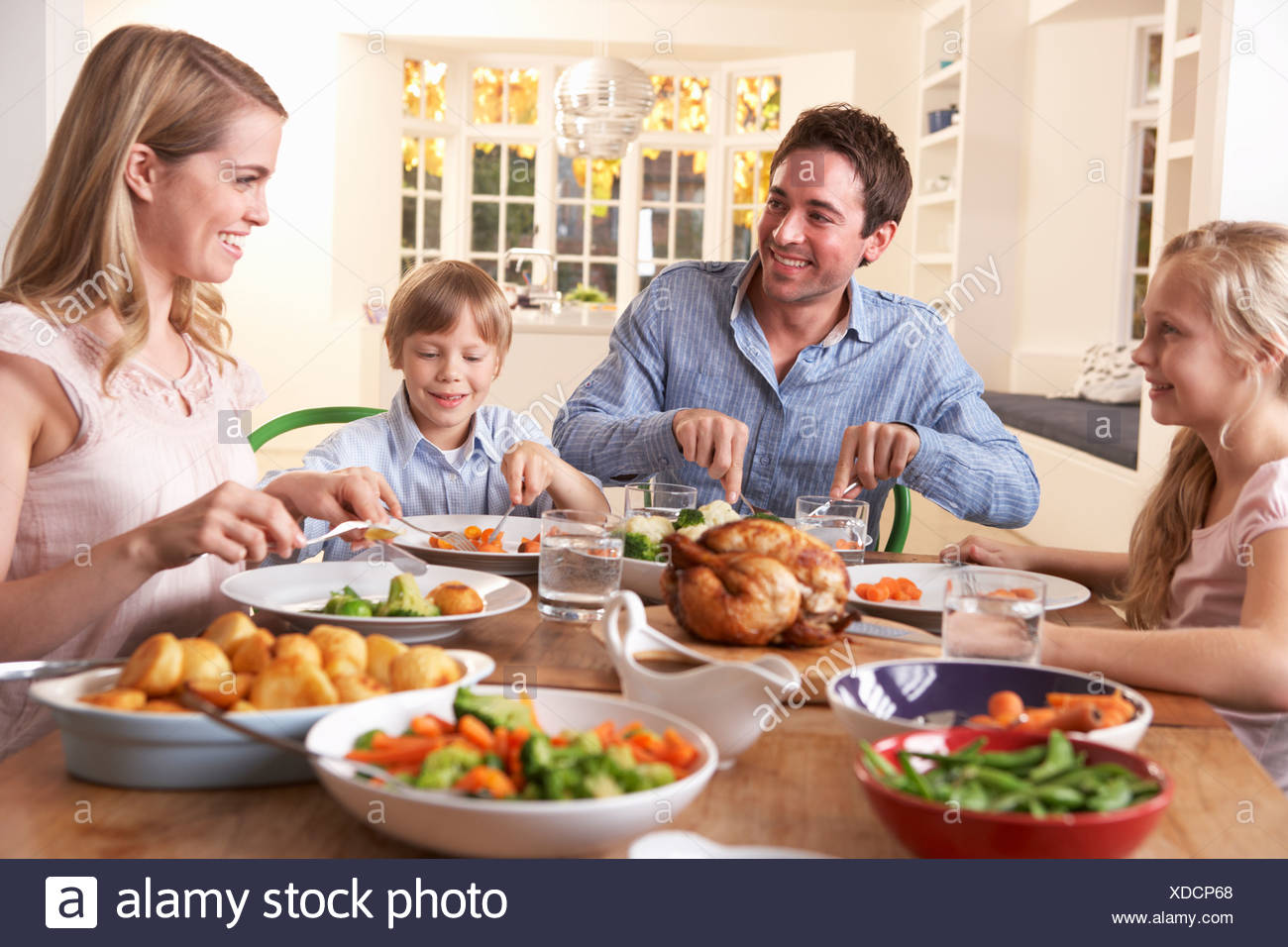Family At The Dinner Table High Resolution Stock Photography and Images ...