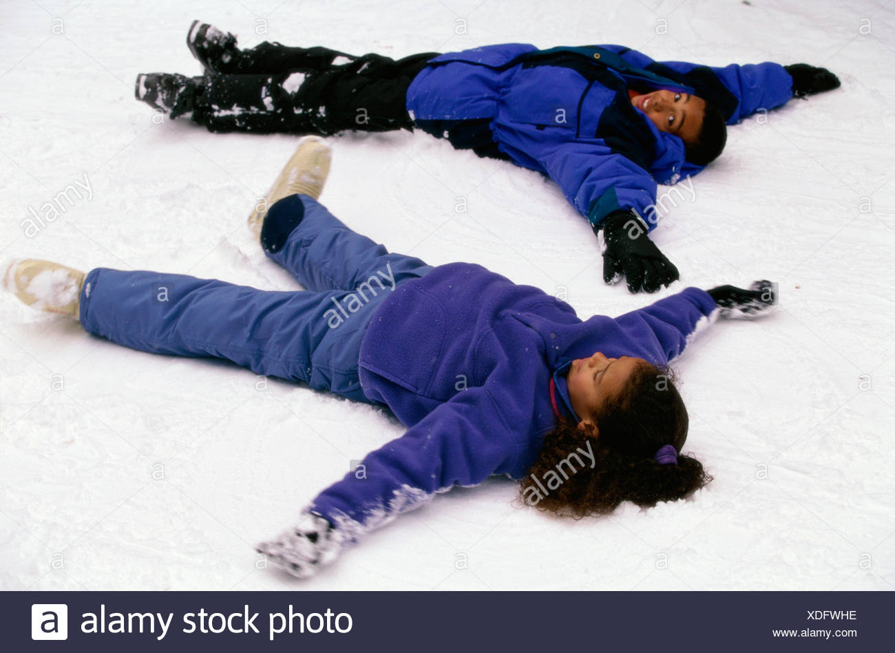 Children Making Snow Angels High Resolution Stock Photography and ...