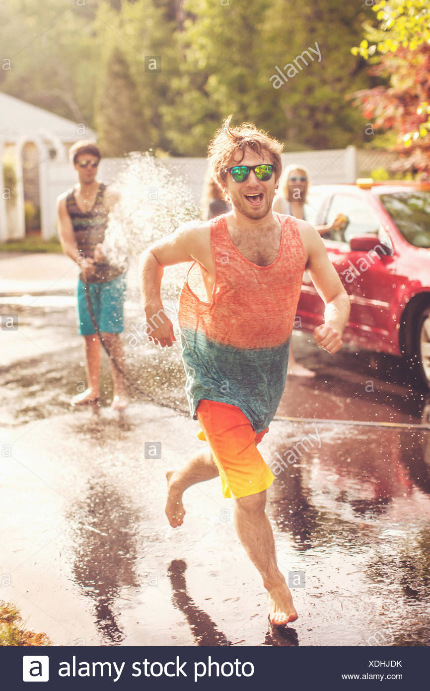Man Holding Hose High Resolution Stock Photography and Images - Alamy