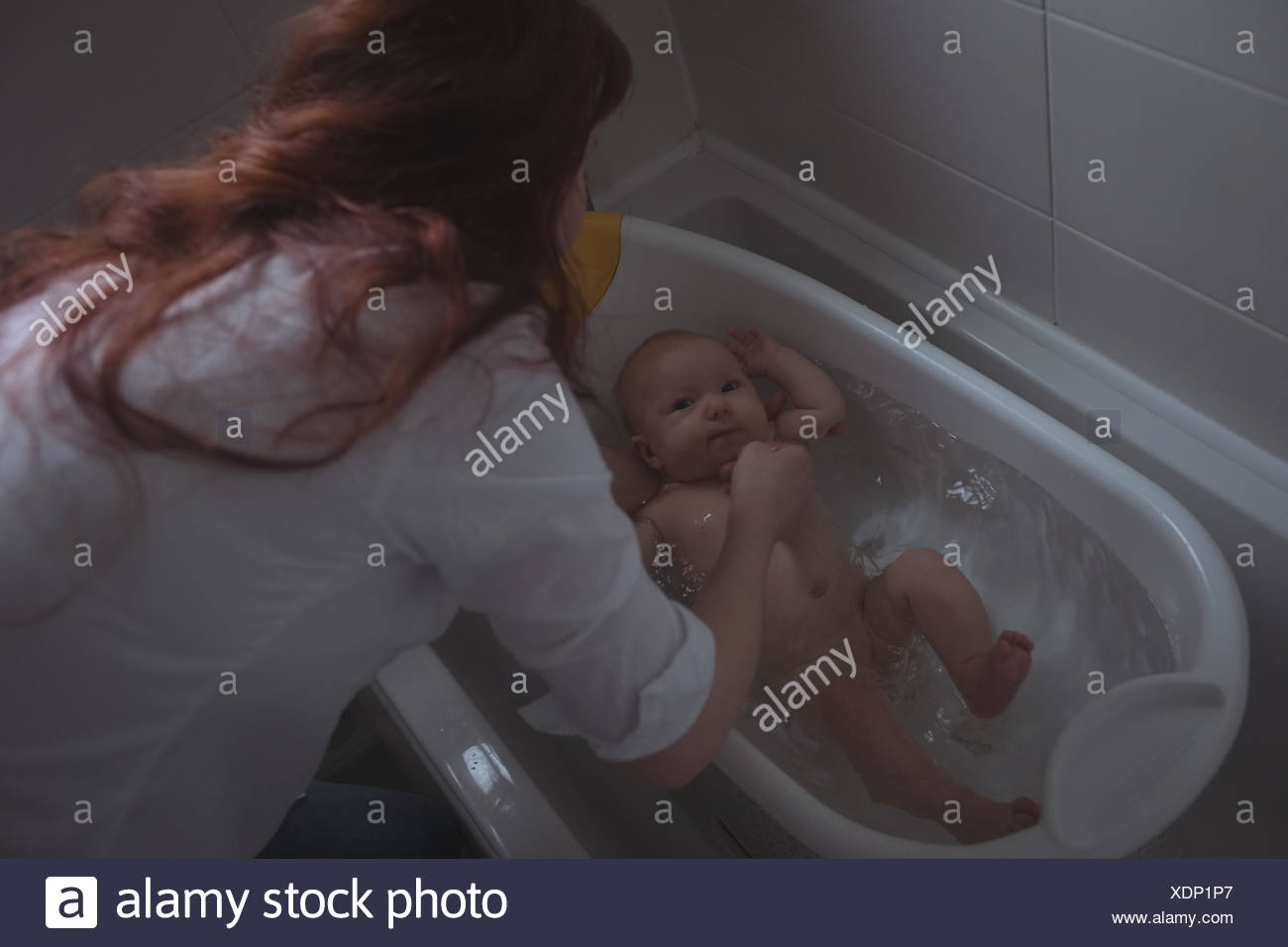 Woman Bathing Baby High Resolution Stock Photography and Images - Alamy