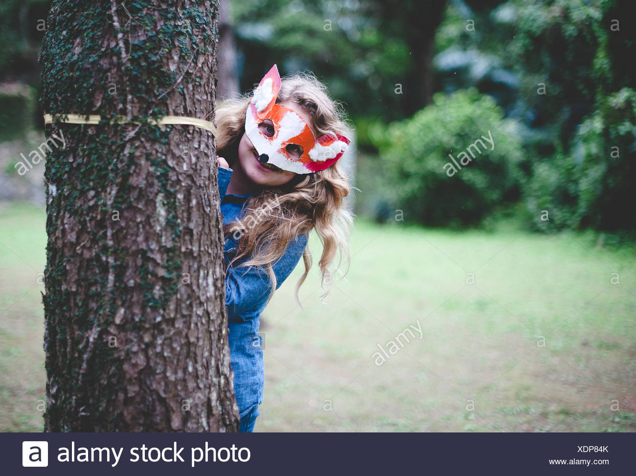 Hiding Behind A Tree High Resolution Stock Photography and Images - Alamy
