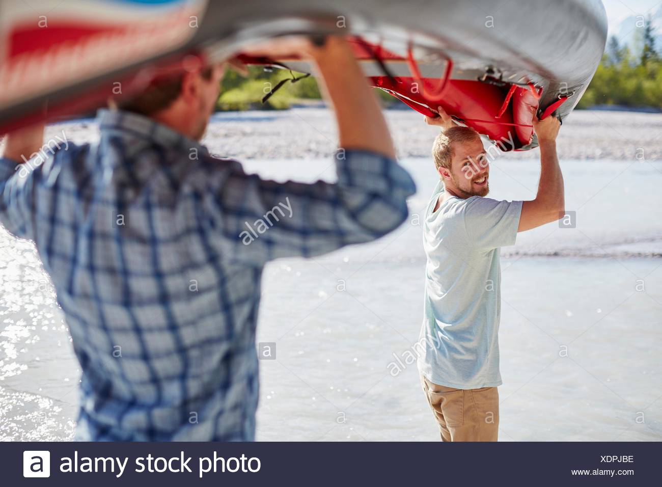 Man Carrying Above Head Stock Photos & Man Carrying Above Head Stock ...