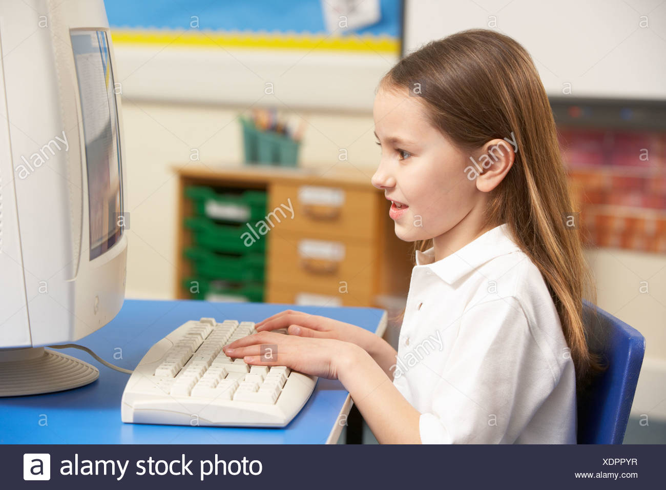 Schoolgirl In Class Using Computer Stock Photos & Schoolgirl In Class ...