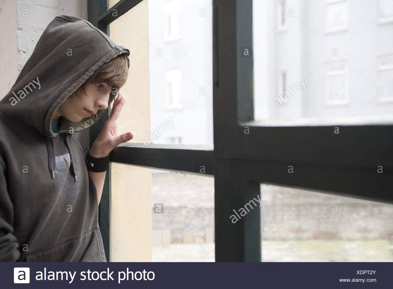 Boy Looking Out Window Sad Stock Photos & Boy Looking Out Window Sad ...