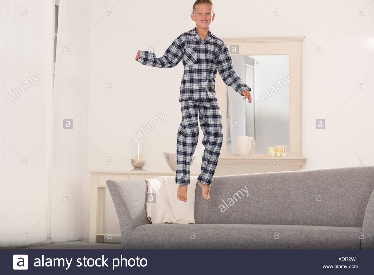Boy Jumping On Sofa High Resolution Stock Photography and Images - Alamy