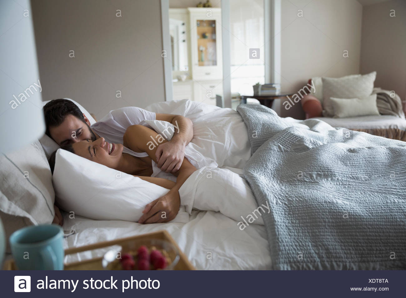 Couple Cuddling Bed Stock Photos & Couple Cuddling Bed Stock Images - Alamy