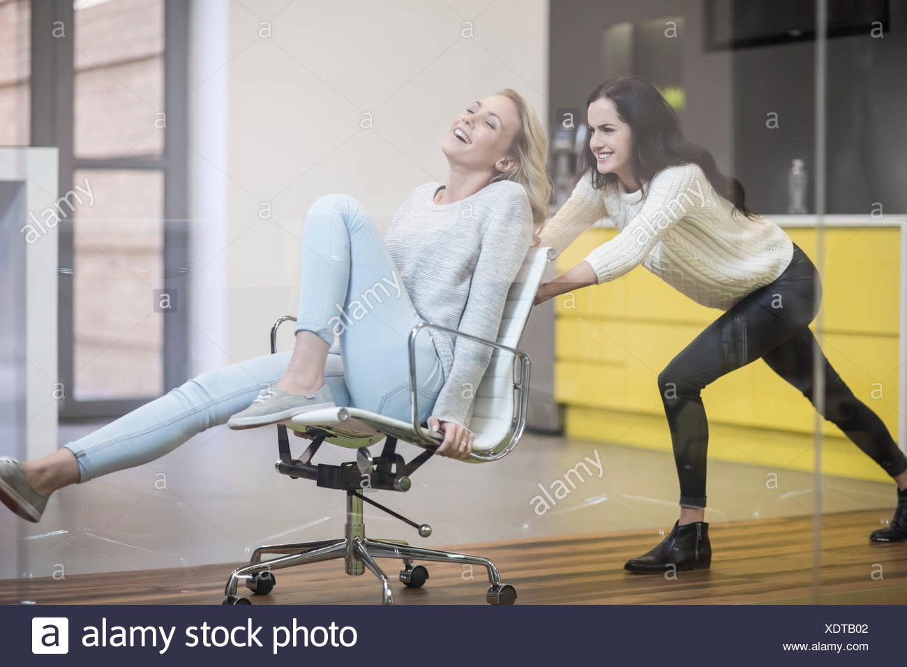 Young Woman Pushing Chair High Resolution Stock Photography and Images ...