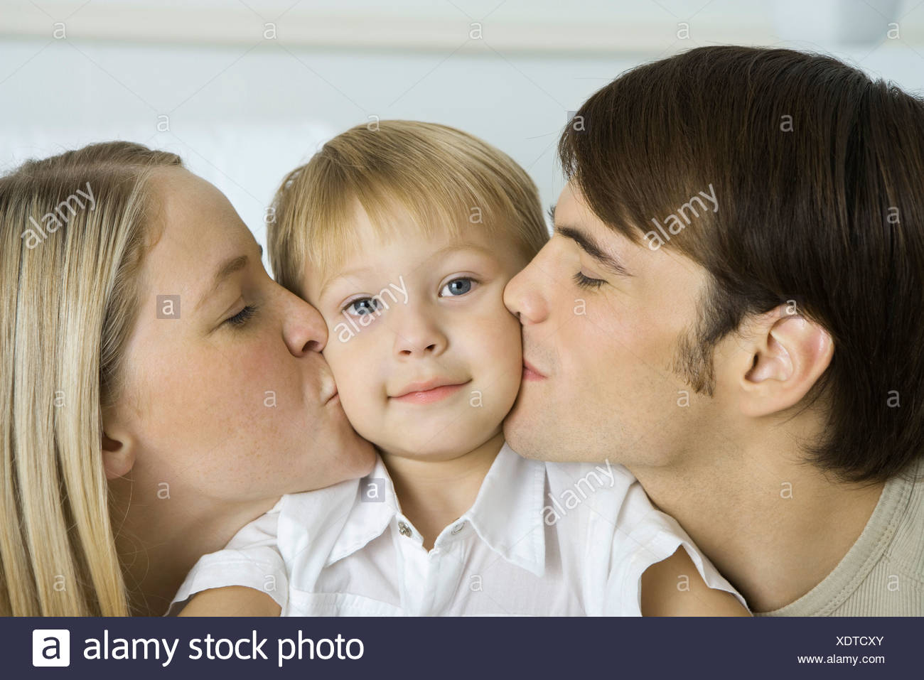 Parents Kissing Their Children High Resolution Stock Photography and ...