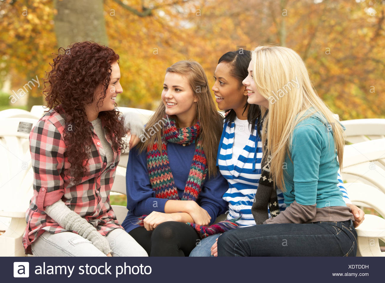 Group Girls Laughing Sitting Outside Stock Photos & Group Girls ...