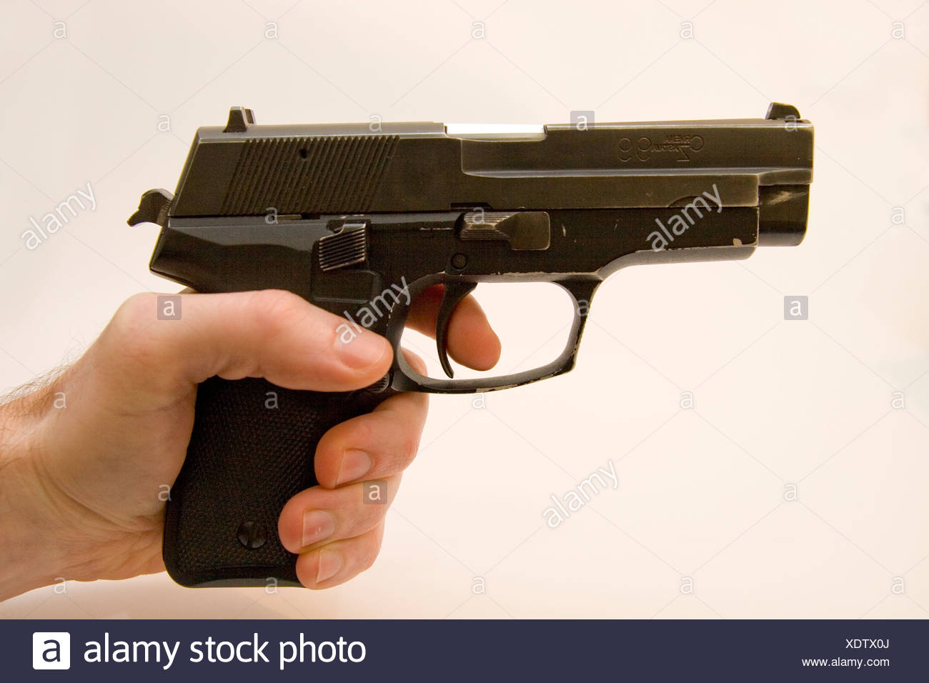 Man Holding 9mm Gun High Resolution Stock Photography and Images - Alamy