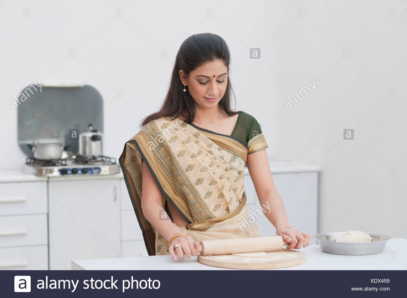 Indian Lady Cooking In Kitchen High Resolution Stock Photography and ...