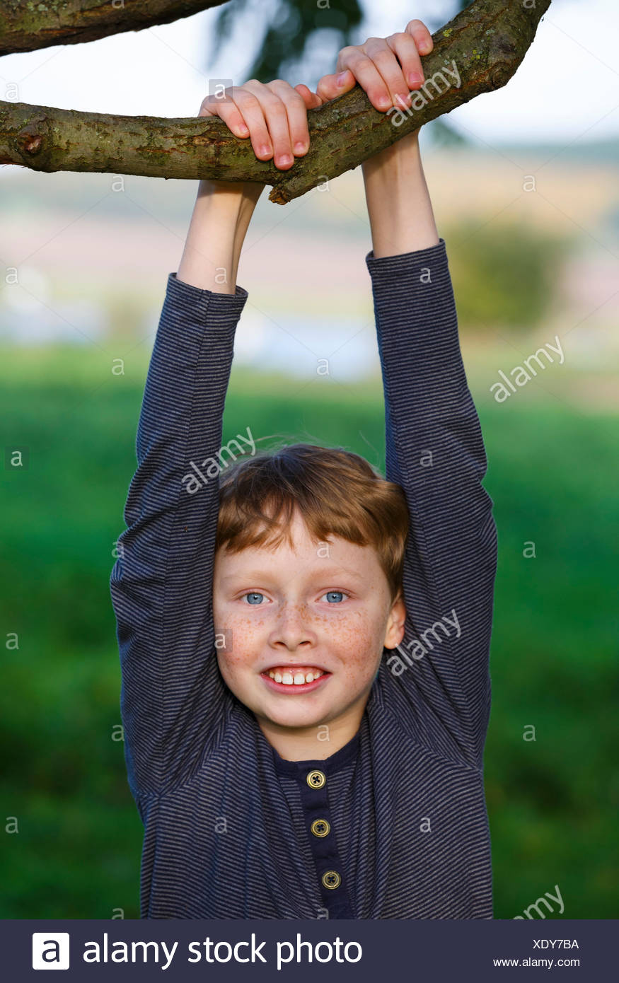 Boy Hanging From A Tree High Resolution Stock Photography and Images ...