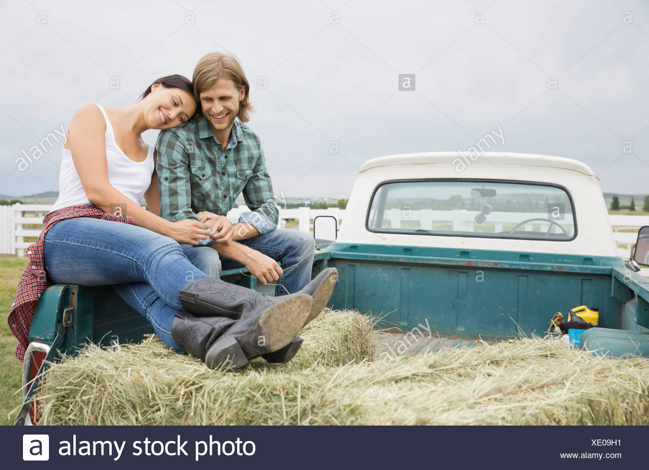 Three People Sitting On Back Stock Photos & Three People Sitting On ...
