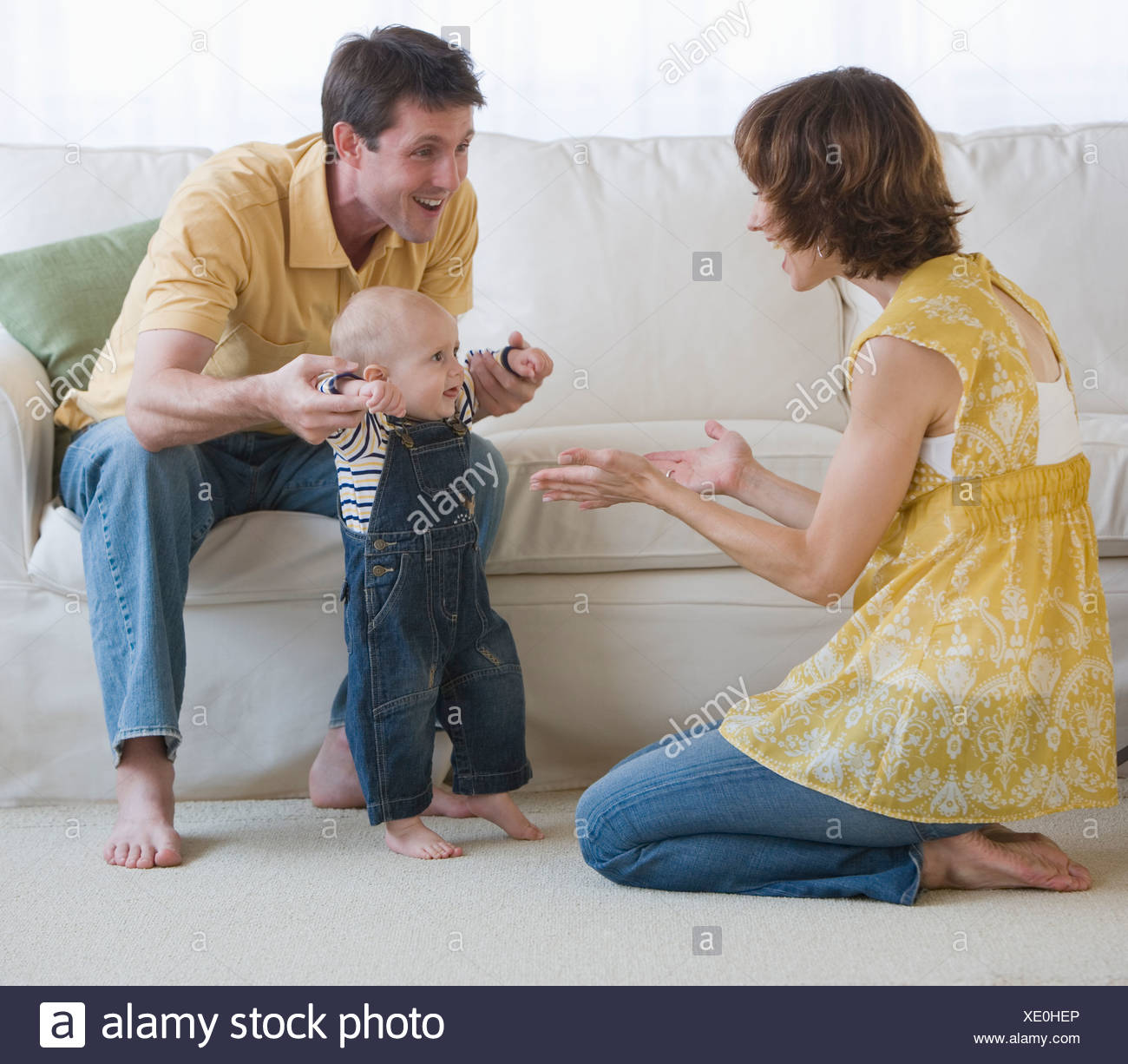 Full Length Parents Helping Baby High Resolution Stock Photography and ...