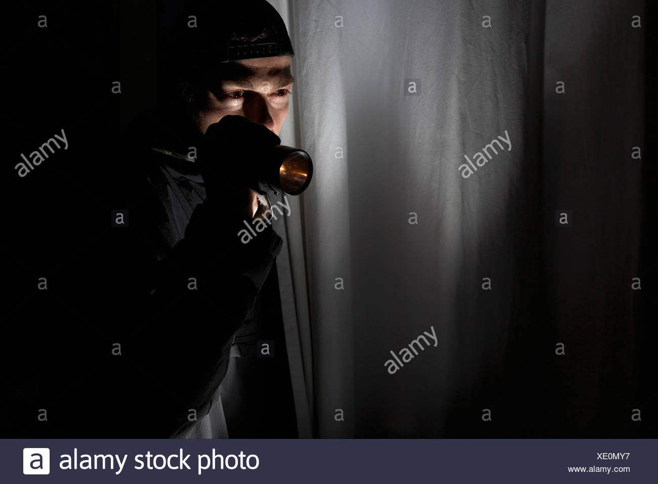 Man Holding Torch In Dark High Resolution Stock Photography and Images ...
