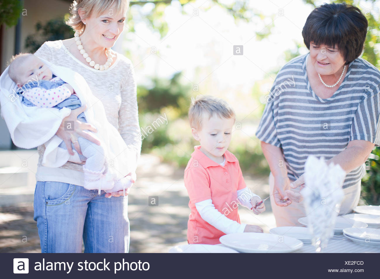 Family Setting Table Dinner High Resolution Stock Photography and ...