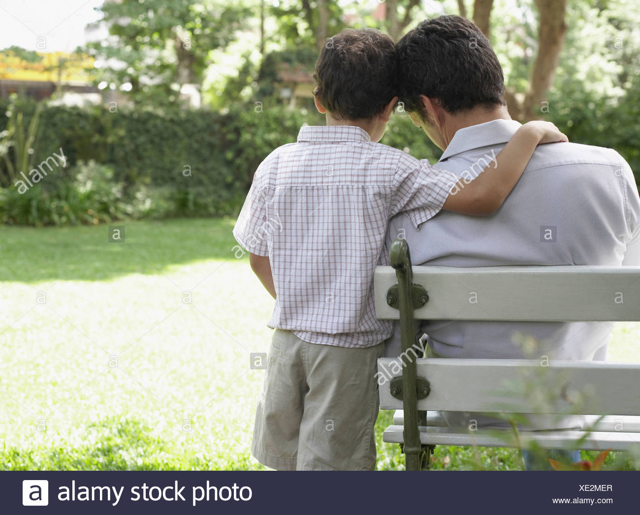 Boy Sitting On Wooden Bench Stock Photos & Boy Sitting On Wooden Bench ...