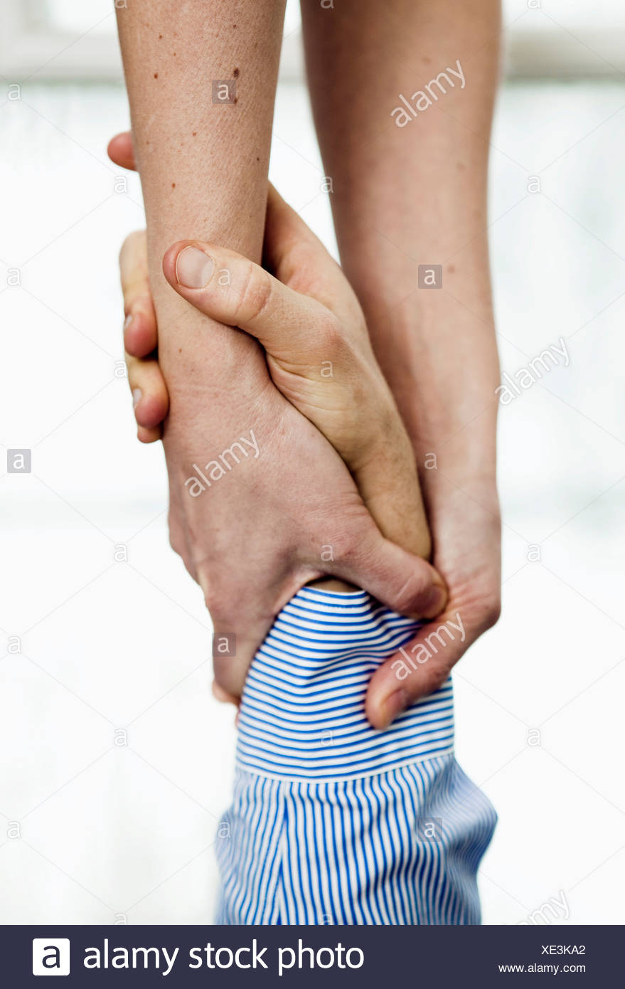 Grasping Hands High Resolution Stock Photography and Images - Alamy
