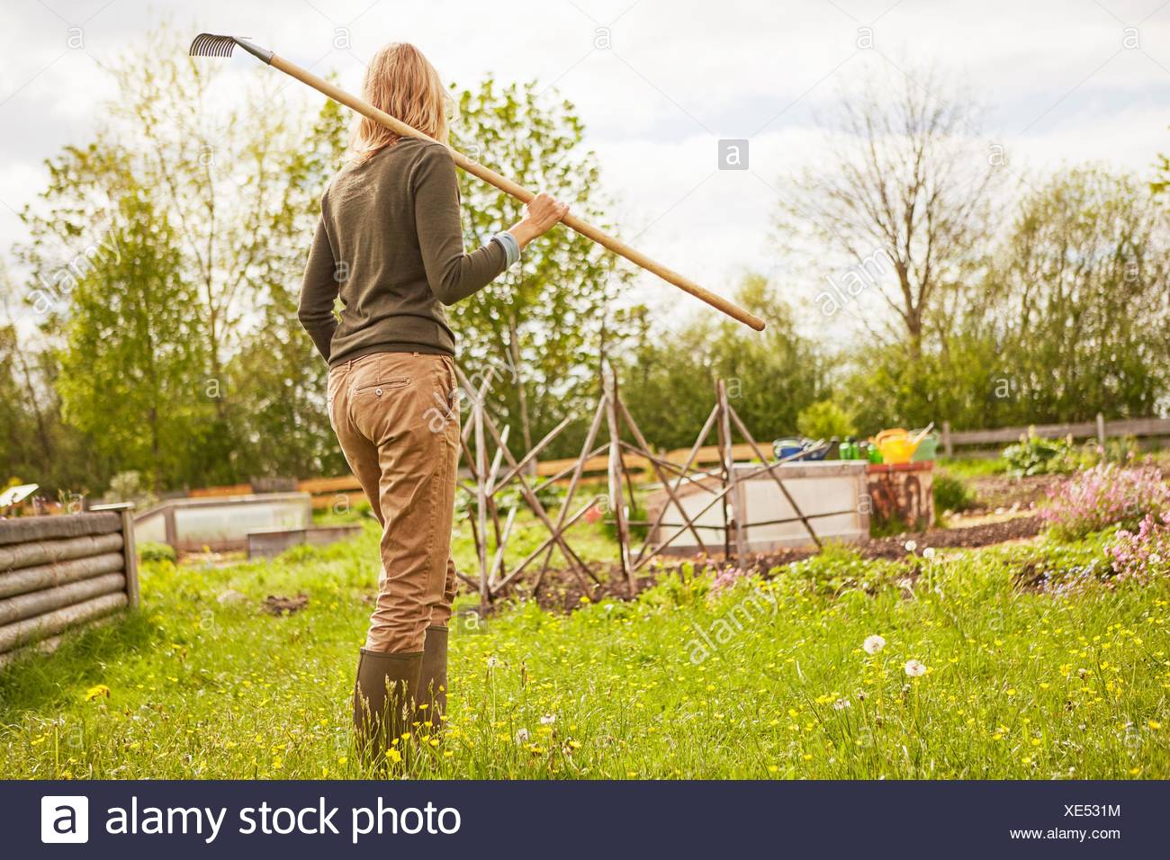 Woman With Rake High Resolution Stock Photography and Images - Alamy