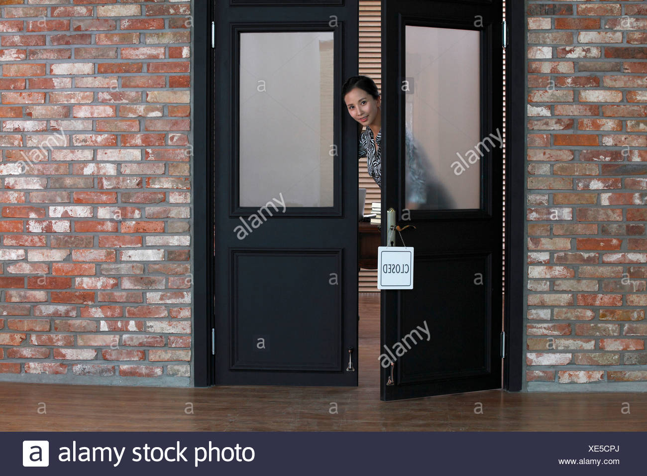 Young Woman Closing Office Door High Resolution Stock Photography and ...