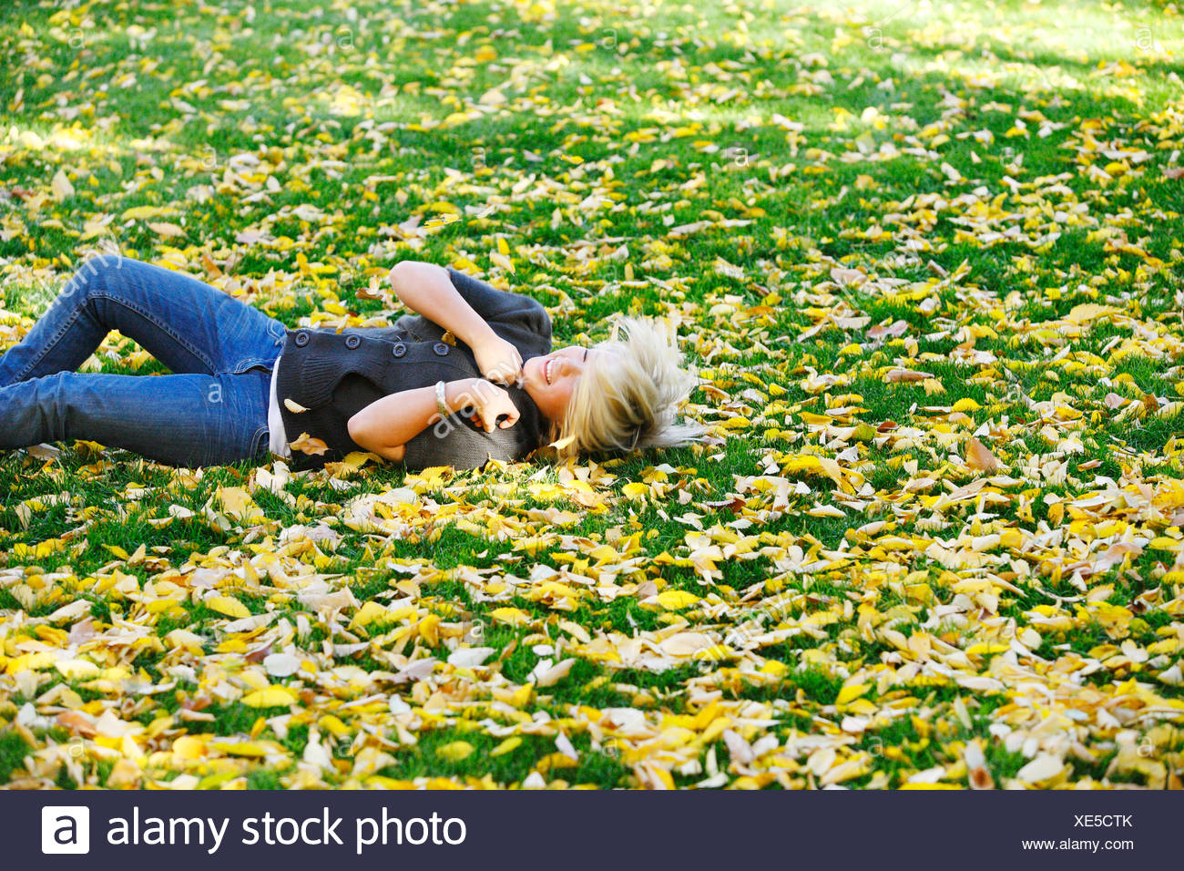 Girl Rolling Down Hill Stock Photos & Girl Rolling Down Hill Stock ...