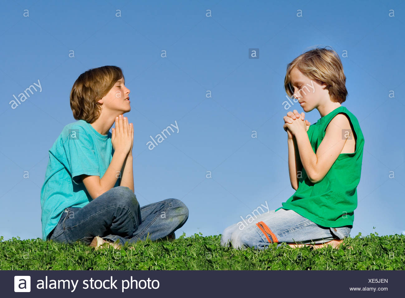 Child Praying Kneeling Prayer High Resolution Stock Photography and ...