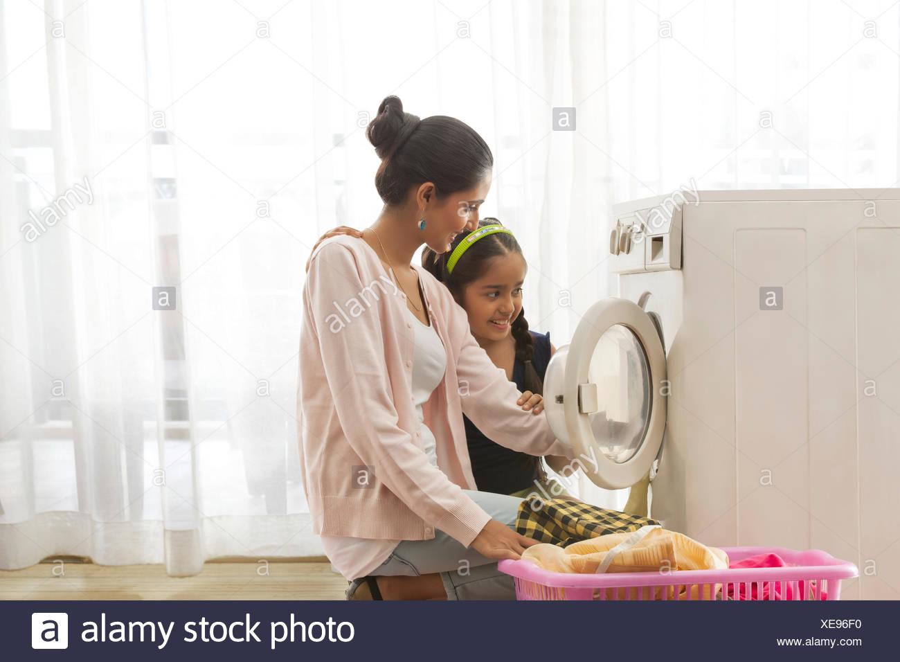Two Women Doing Laundry High Resolution Stock Photography and Images ...