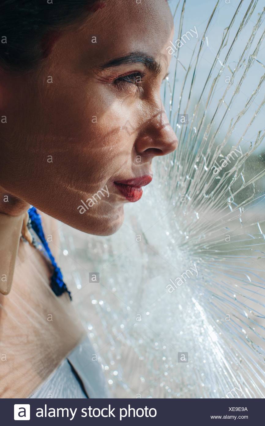Woman Broken Window High Resolution Stock Photography and Images - Alamy