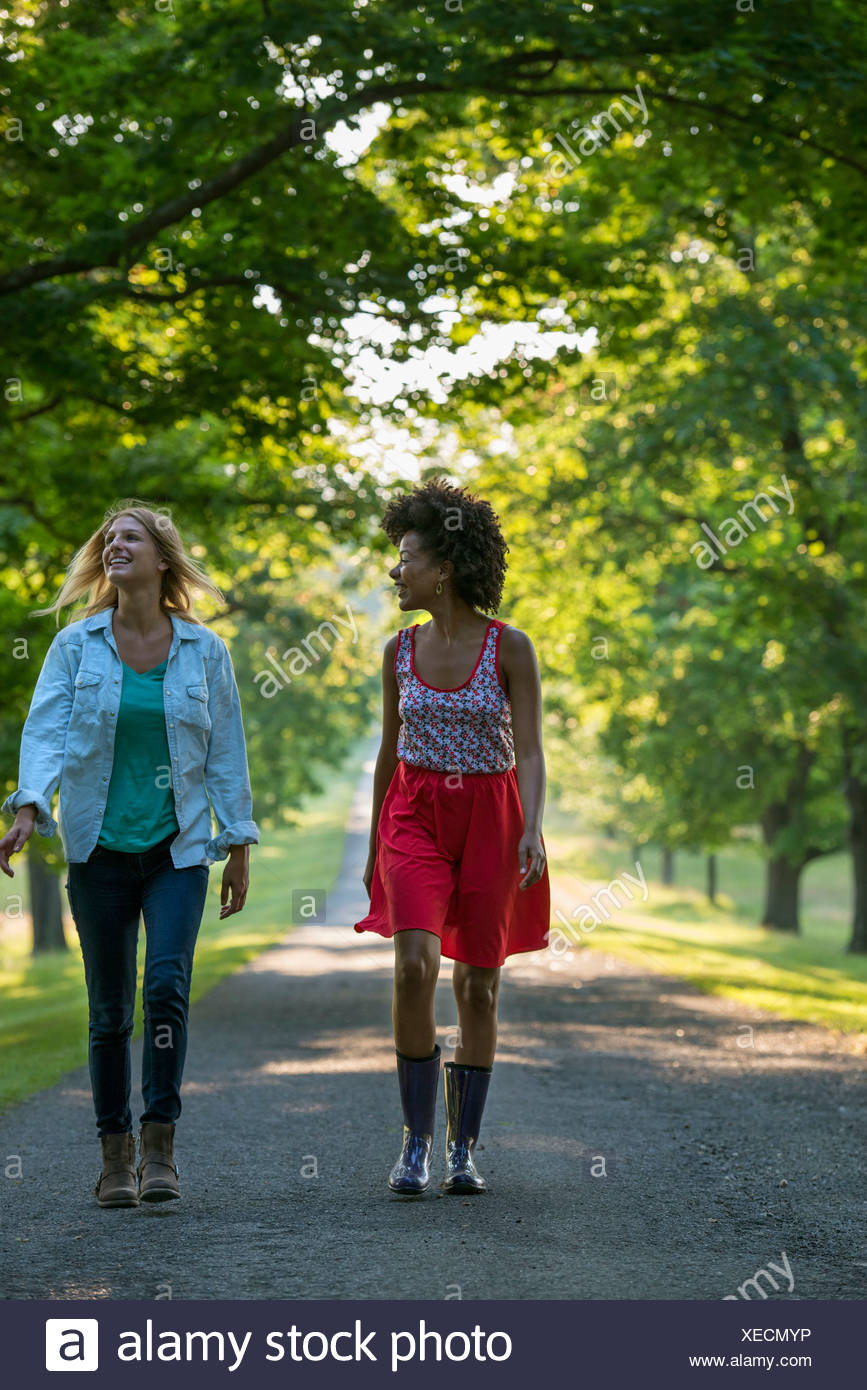 Two Young Beautiful Women Walking Stock Photos & Two Young Beautiful ...