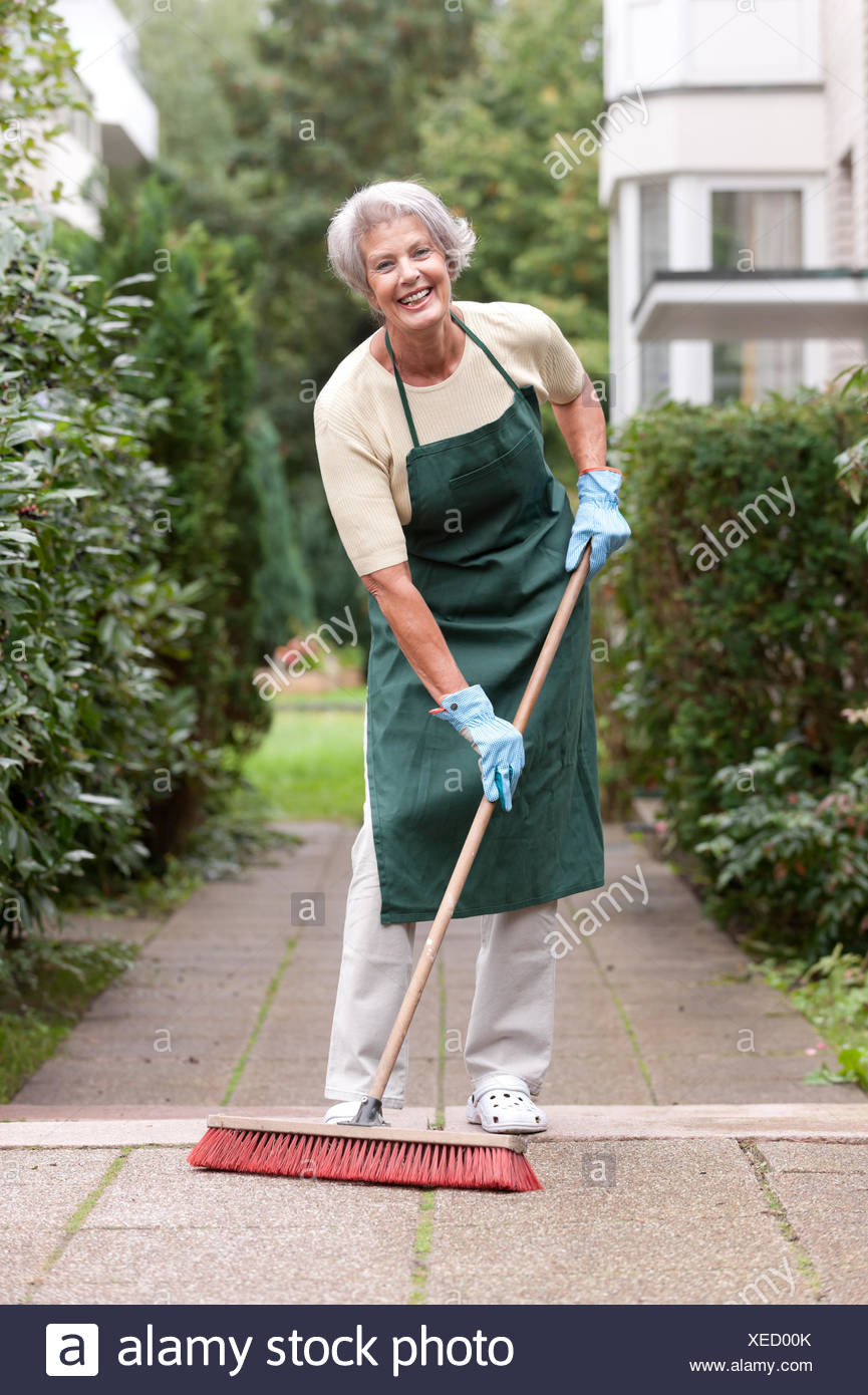 Elderly Woman Sweeping Outside Old High Resolution Stock Photography ...