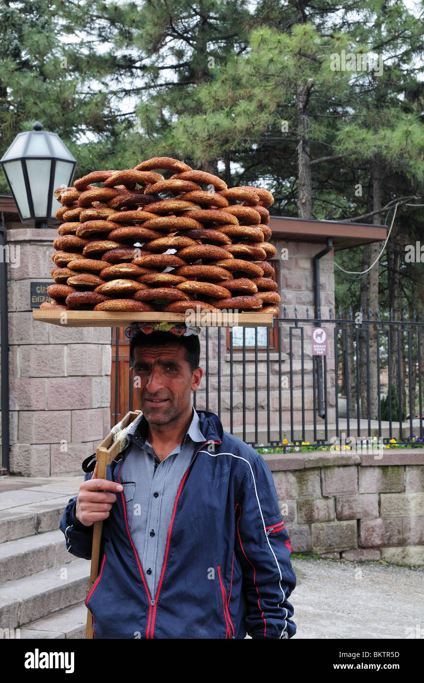 Turkish man carrying simit the traditional Turkish bread on his head ...
