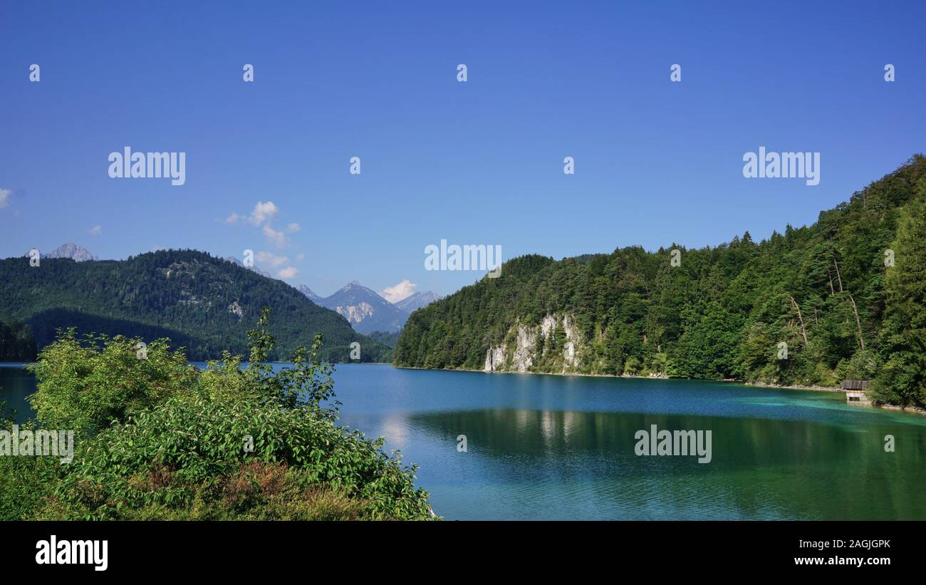 Im hintergrund alpsee -Fotos und -Bildmaterial in hoher Auflösung – Alamy