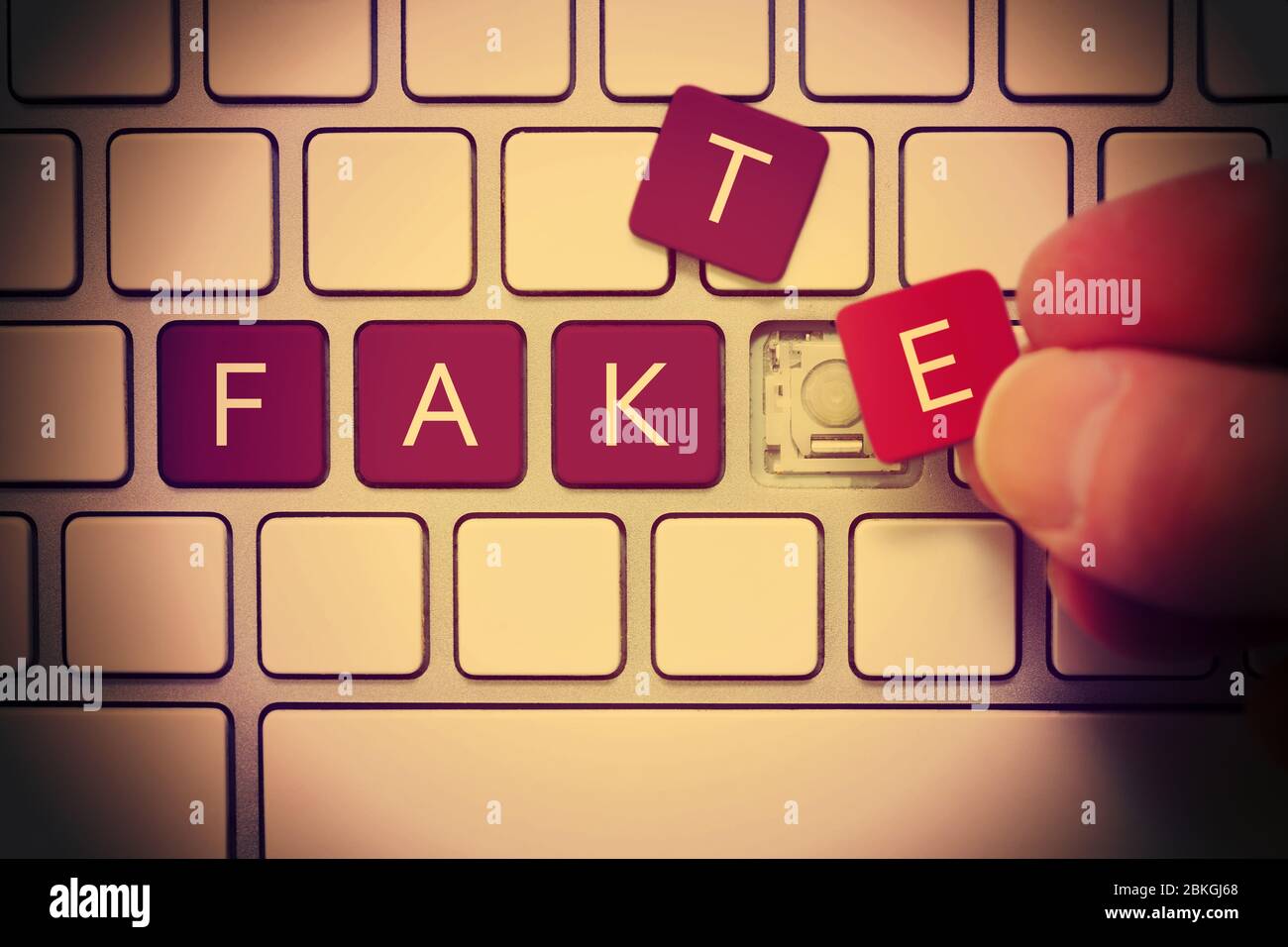 FOTOMONTAGE, Computer keys labeled Fake, Symbol photo for Fake News ...