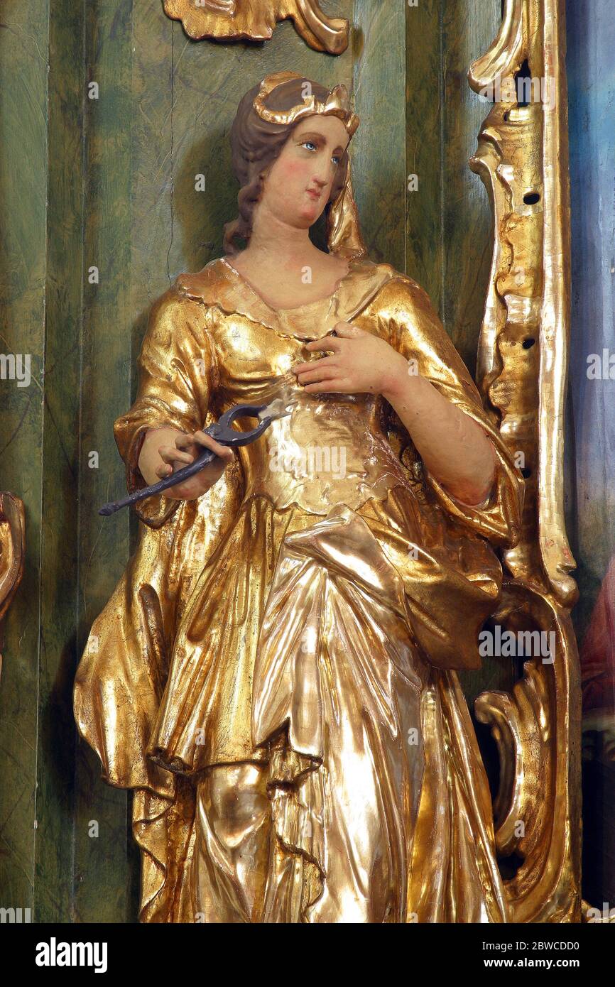 Heilige Apollonia, Statue auf dem Altar der Heiligen Barbara in der Pfarrkirche St. Peter in ...