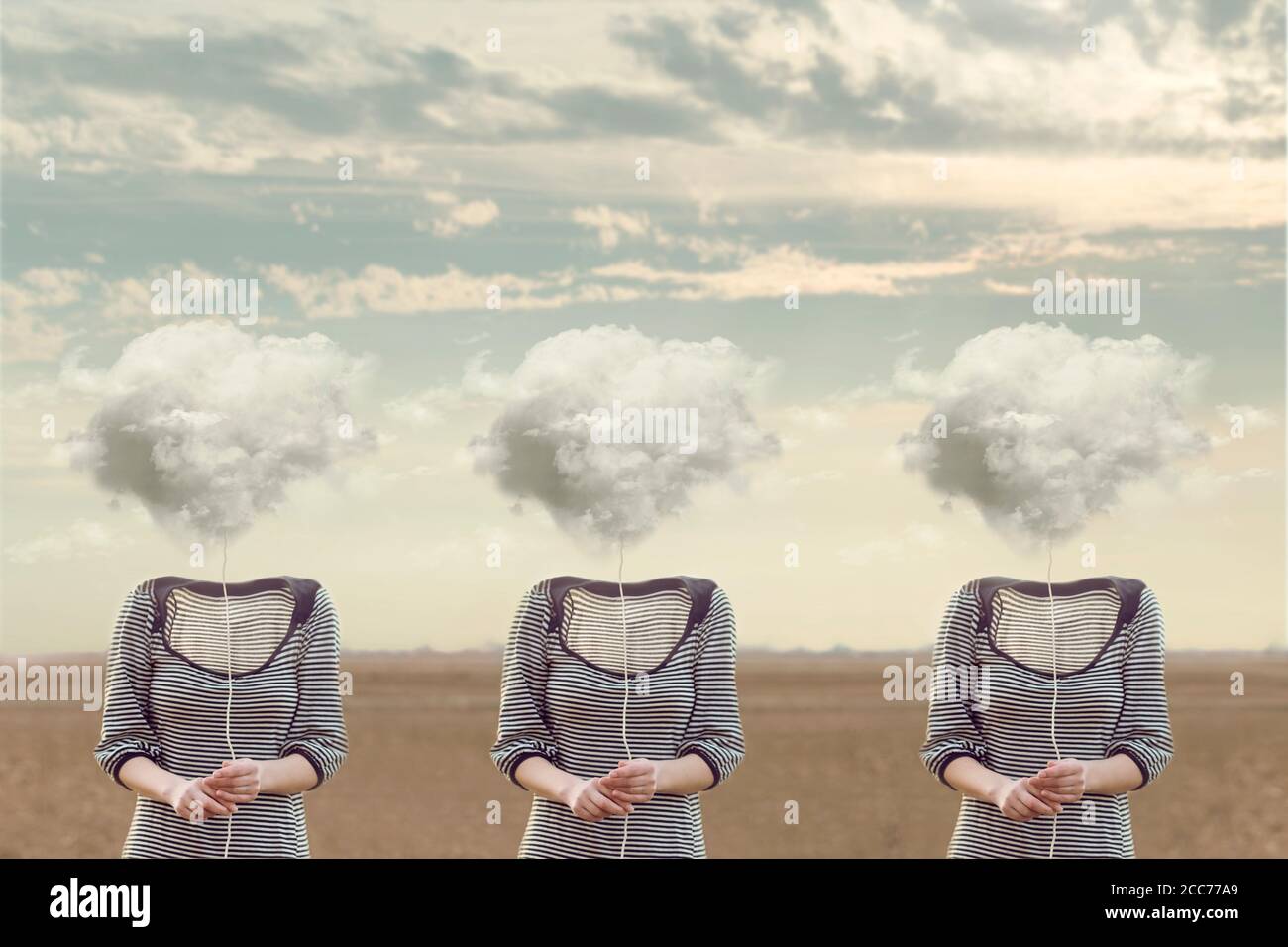 Drei gleiche Personen, die sein Gesicht mit einem wolkenverhenkten ...