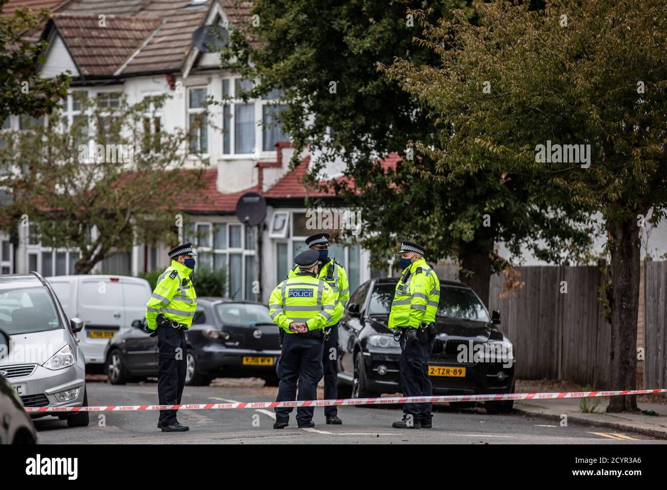 Metropolitan Police Officers and Forensic Officers outside the address ...