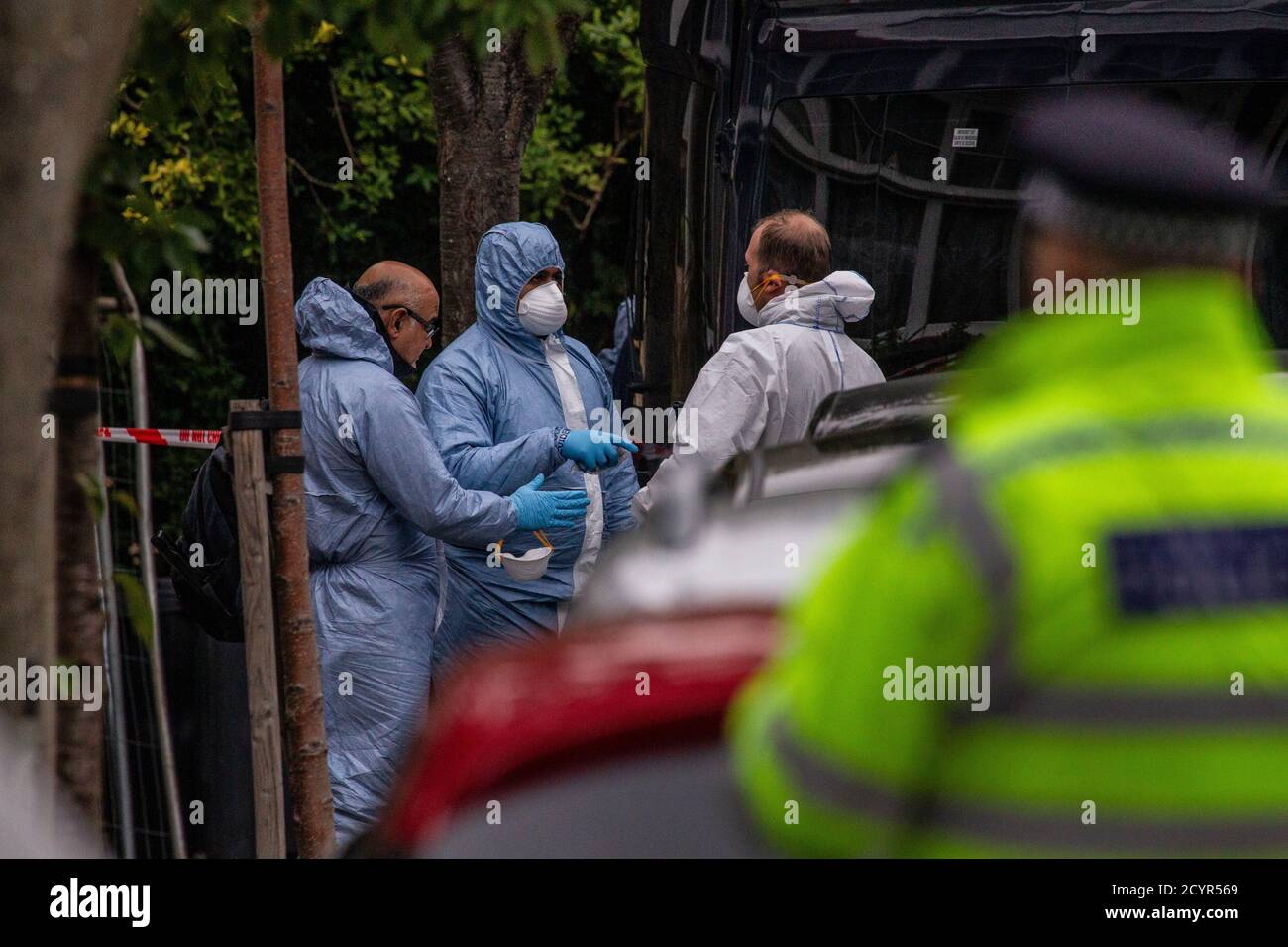 Metropolitan Police Officers and Forensic Officers outside the address ...