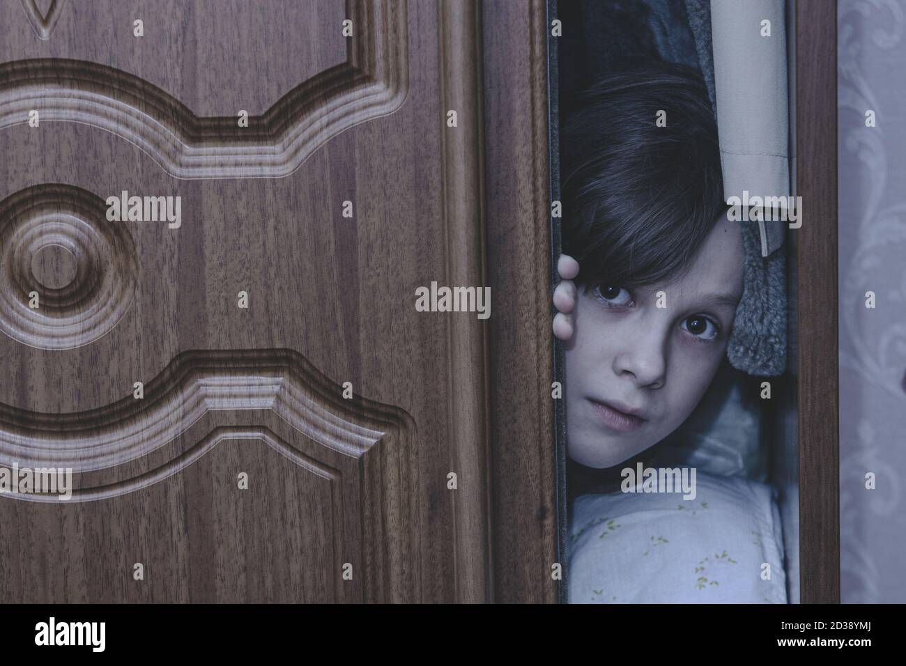 Hiding in closet -Fotos und -Bildmaterial in hoher Auflösung – Alamy