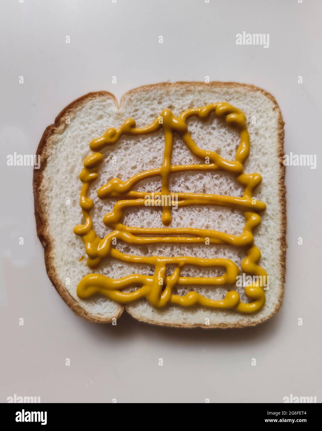 Laib Brot mit Senf Stockfotografie - Alamy