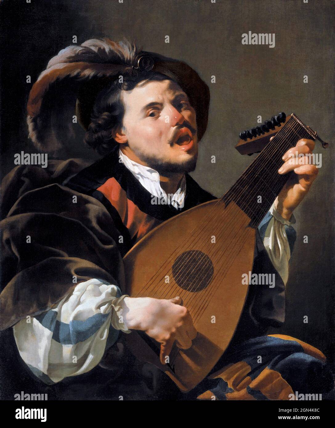 Ein mann, der eine laute spielt -Fotos und -Bildmaterial in hoher ...