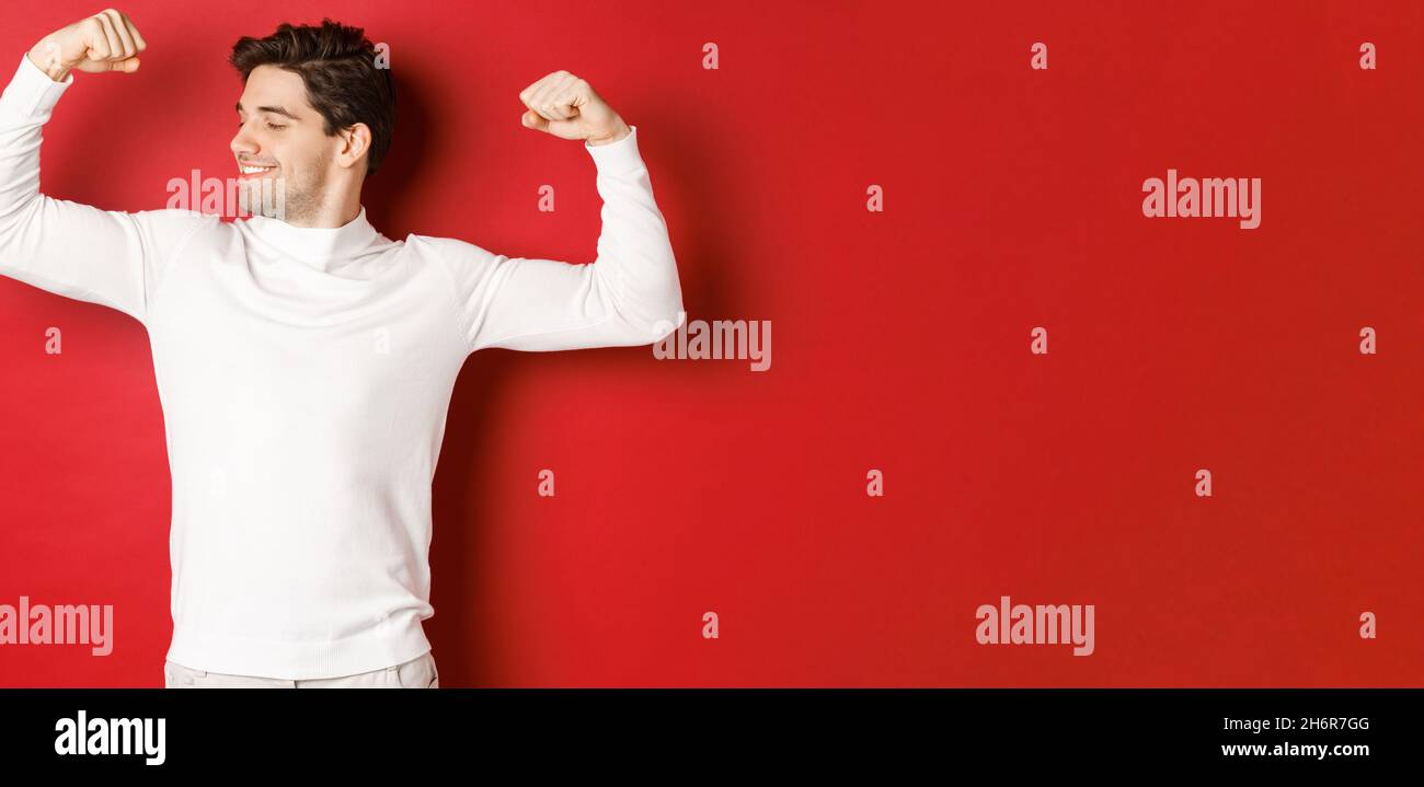 Boy flexing muscles white background -Fotos und -Bildmaterial in hoher ...