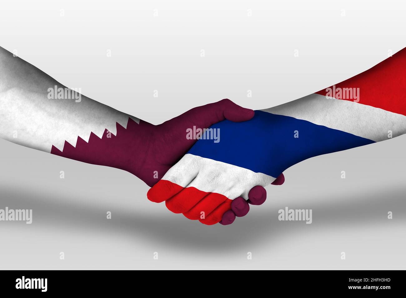 Handschlag zwischen thailand und katar Flaggen auf Händen gemalt ... Handschlag zwischen thailand und katar Flaggen auf Händen gemalt ...