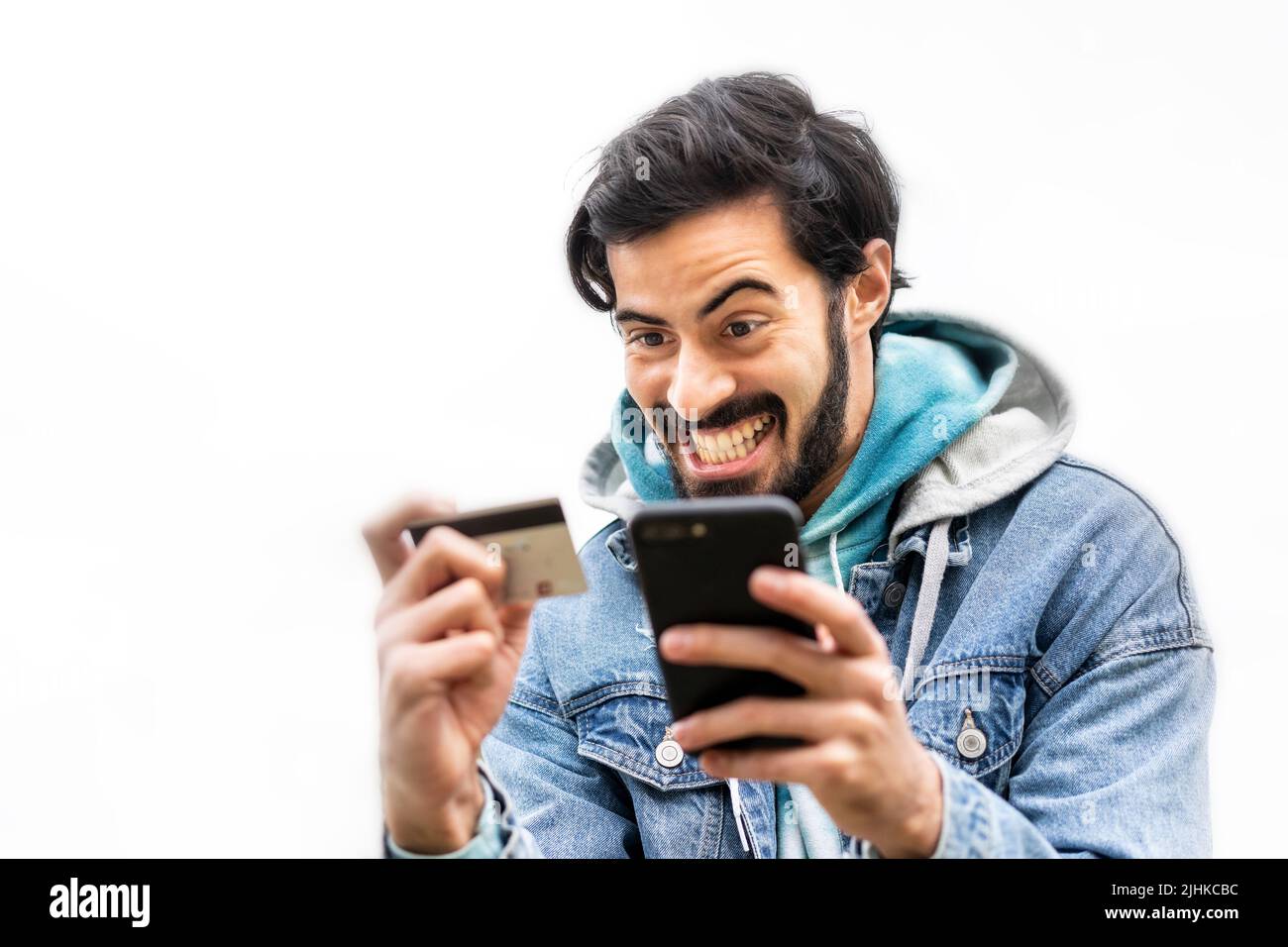 Debitkarte am telefon -Fotos und -Bildmaterial in hoher Auflösung – Alamy