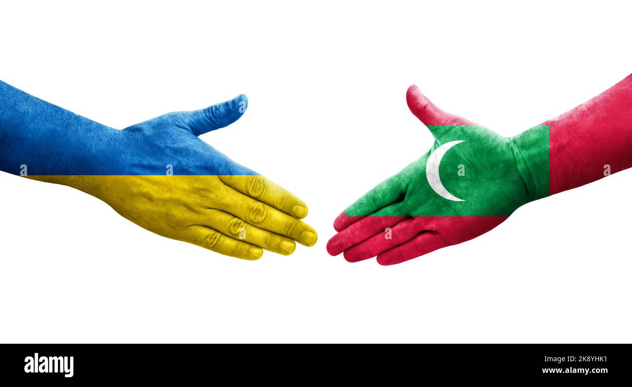 Handschlag zwischen Malediven- und Ukraine-Flaggen auf Händen gemalt ...